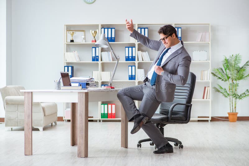 The Businessman Having Fun Taking a Break in the Office at Work Stock ... The Businessman Having Fun Taking a Break in the Office at Work Stock ...