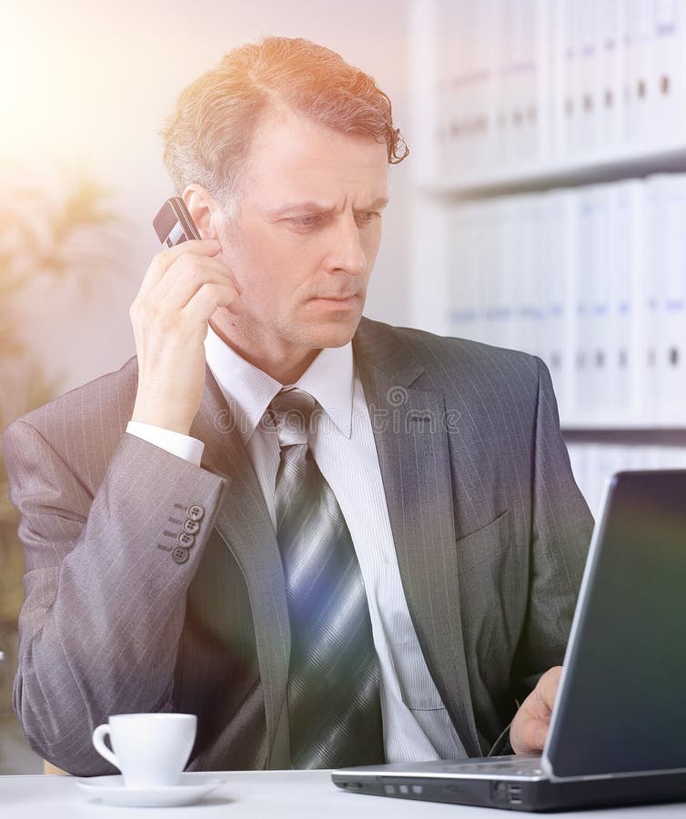 Businessman Having Phone Call Conversation at Workplace Stock Photo ... Businessman Having Phone Call Conversation at Workplace Stock Photo ...