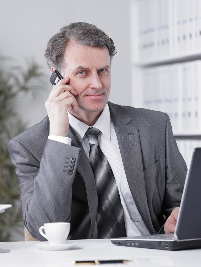 Businessman Having Phone Call Conversation at Workplace Stock Photo ...