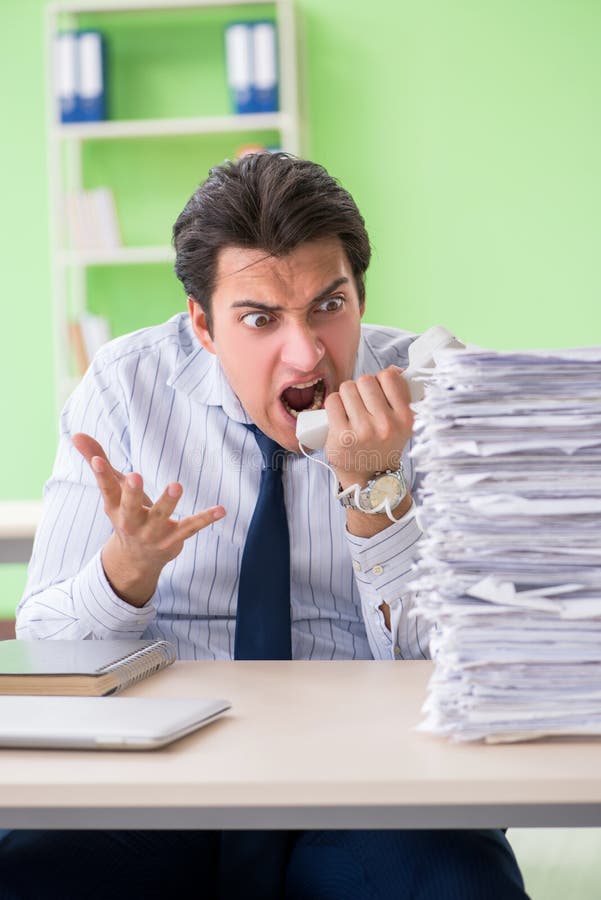 The Businessman Having Problems with Paperwork and Workload Stock Photo ...