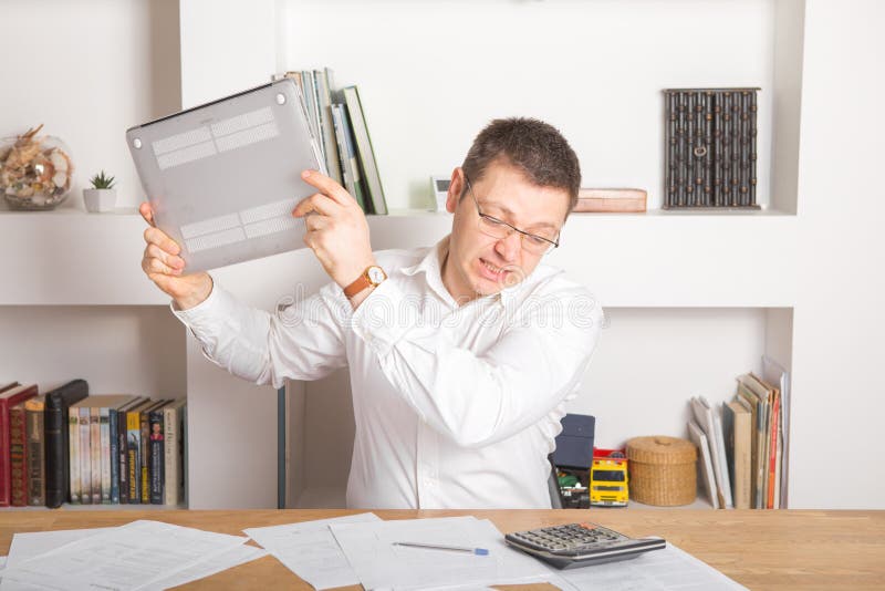 Businessman Having Stress with Laptop Computer Working in the Office ...
