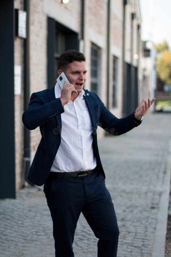 Businessman Having a Stressful Conversation Over the Phone Outdoors ...