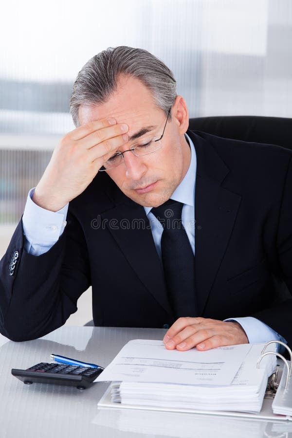 Businessman with Headache in Office Stock Photo - Image of bookkeeper ...