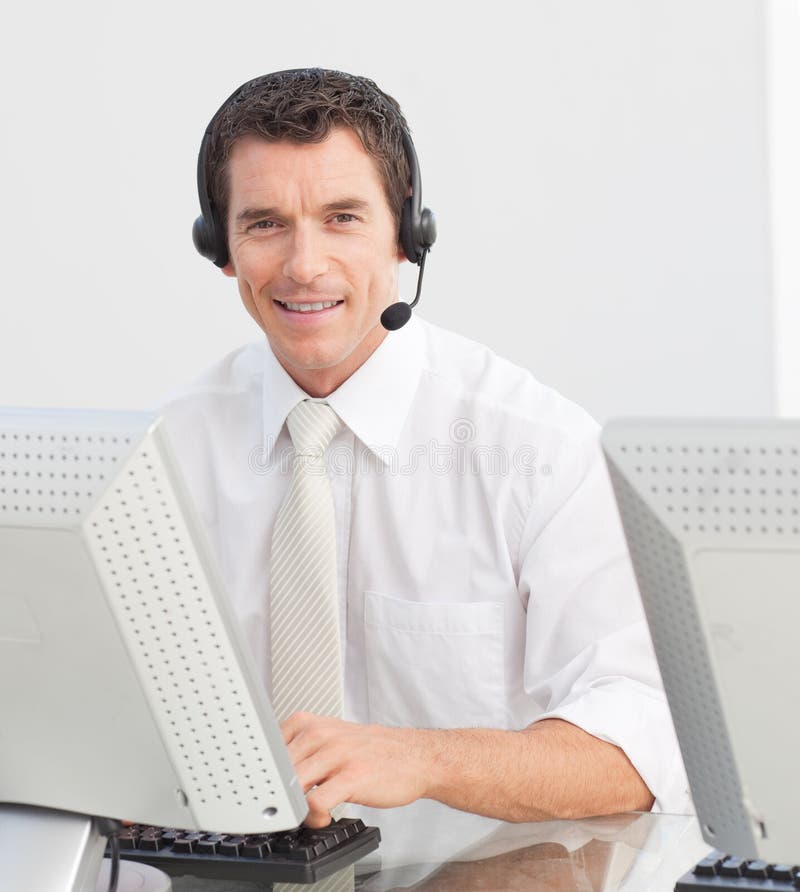 Businessman with a Headset on in a Call Center Stock Image - Image of ...