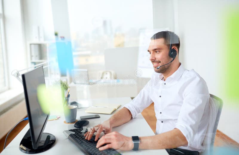 Businessman with Headset and Computer at Office Stock Photo - Image of ...