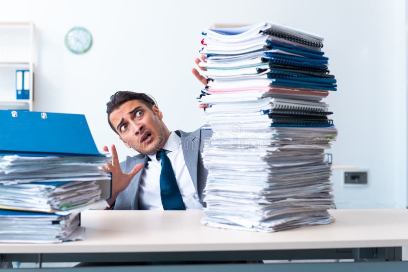 Businessman with Heavy Paperwork Workload Stock Photo - Image of paper ...