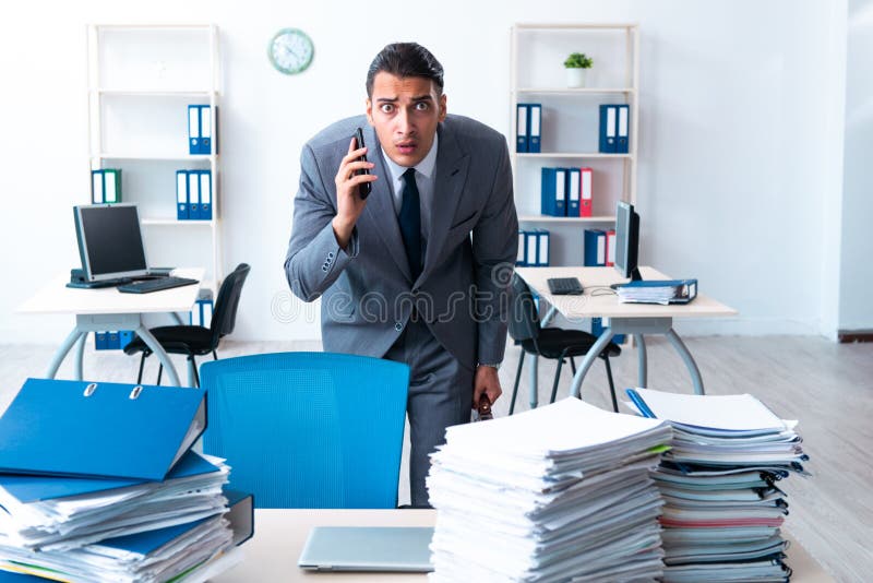 Businessman with Heavy Paperwork Workload Stock Photo - Image of ...