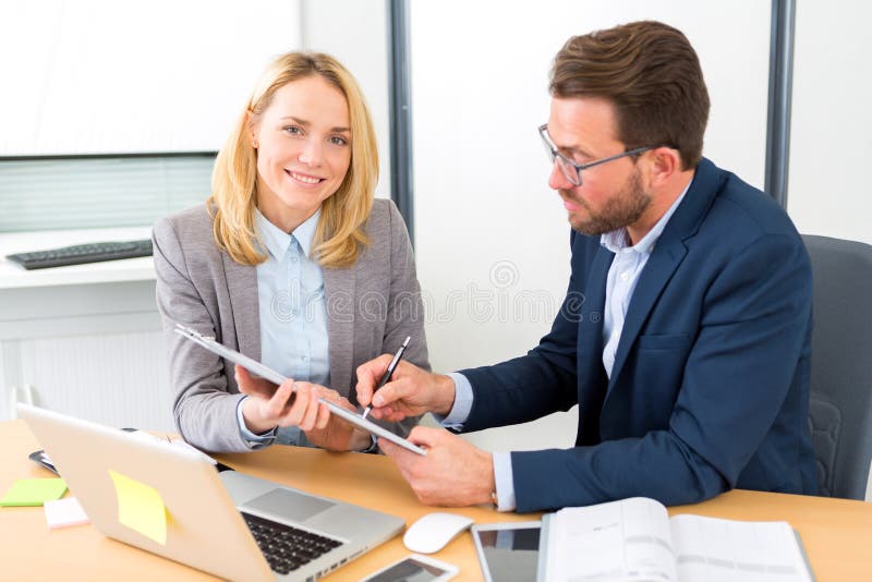 Businessman and His Assistant Working Together at the Office Stock ...