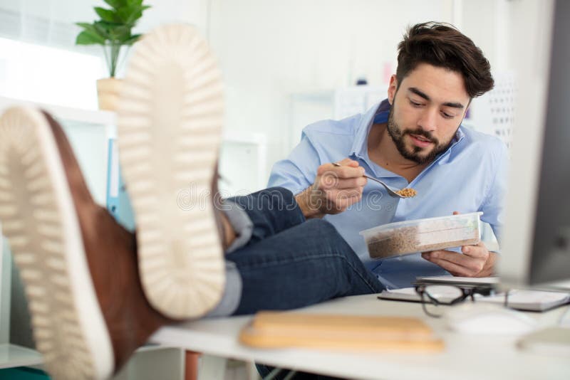 Businessman in Office Having Break Eating Lunch Stock Photo - Image of ...