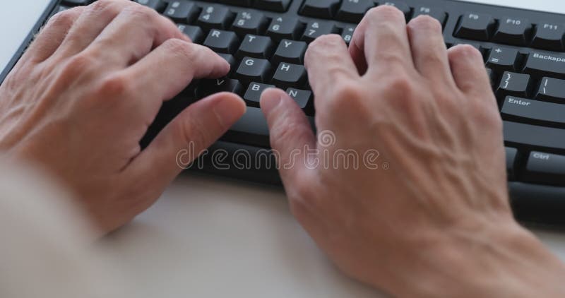 Businessman in His Office Sitting Behind a Computer and Typing on a ...