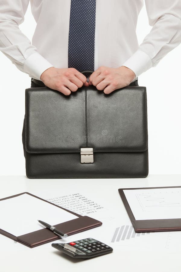 Businessman Holding a Black Briefcase and Standing Near the Work Stock ...