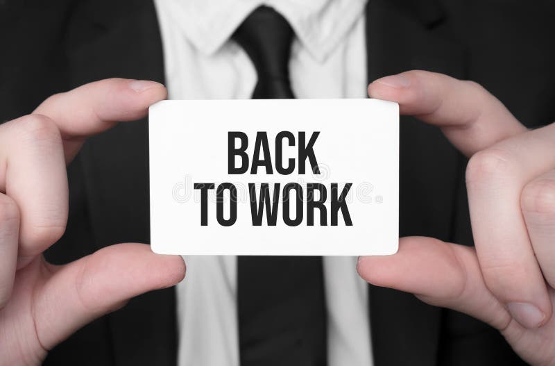 Businessman Holding a Card with Text Back To Work Stock Image - Image ...
