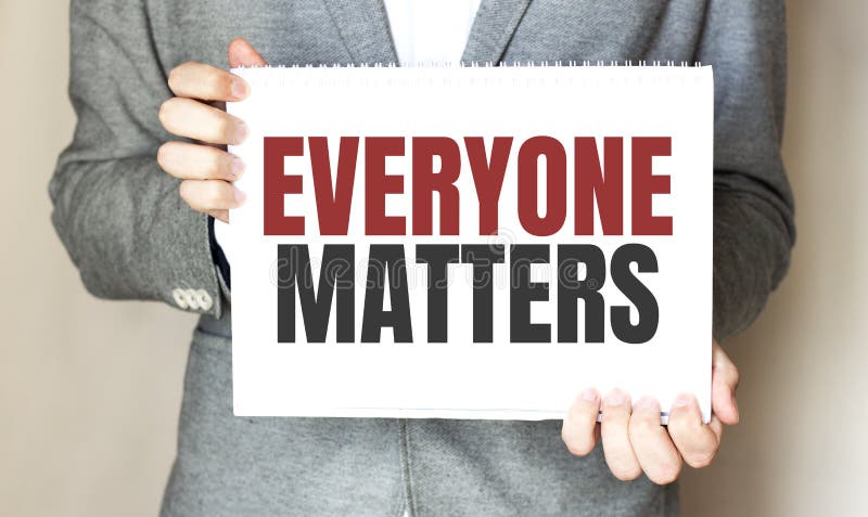 Businessman Holding a Card with Text EVERYONE MATTERS Stock Image ...