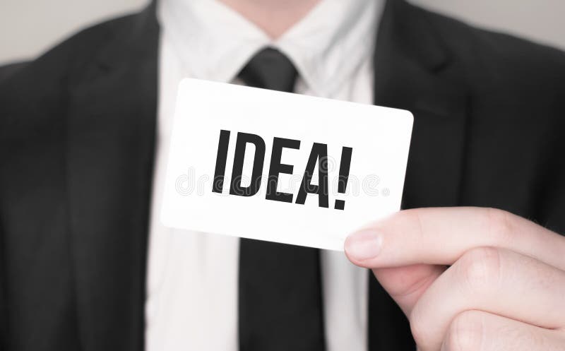 Businessman Holding a Card with Text Idea Stock Image - Image of ...