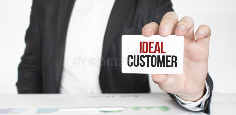 Businessman Holding a Card with Text IDEAL CUSTOMER Stock Image - Image ...