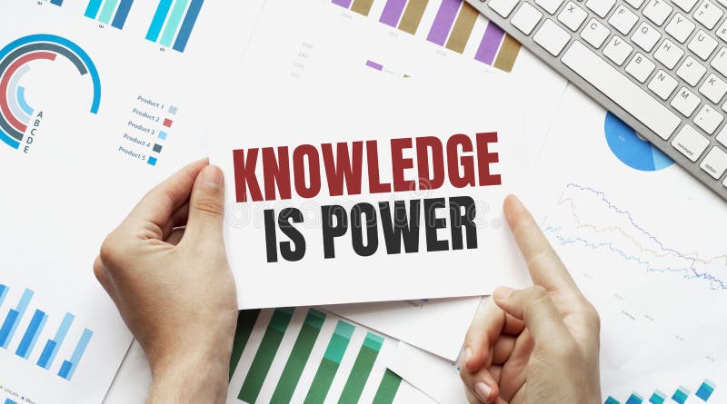 Businessman Holding a Card with Text KNOWLEDGE is POWER. Keyboard ...