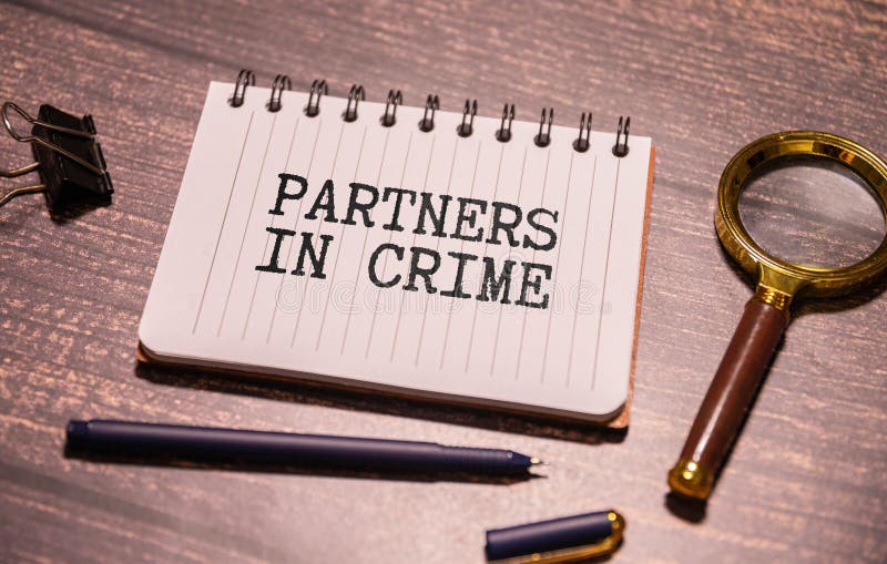 Businessman Holding a Card with Text Partners in Crime. Stock Image ...