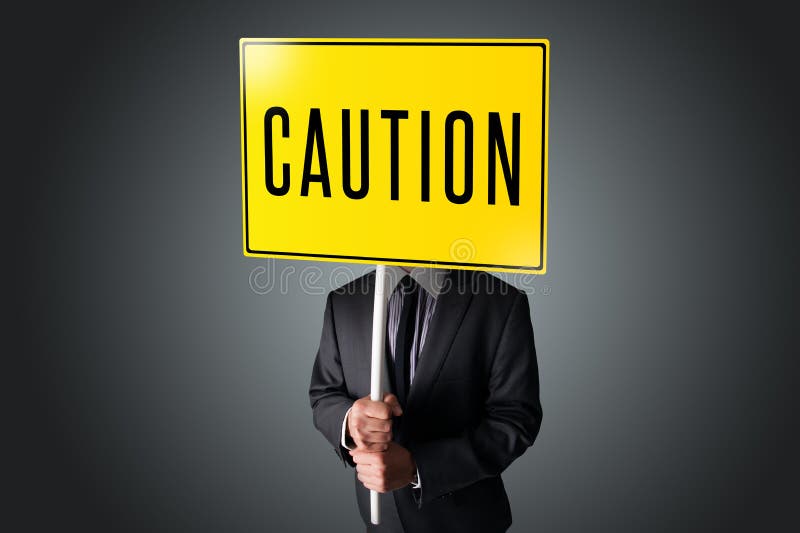 Businessman Holding a Caution Sign Stock Image - Image of dangerous ...