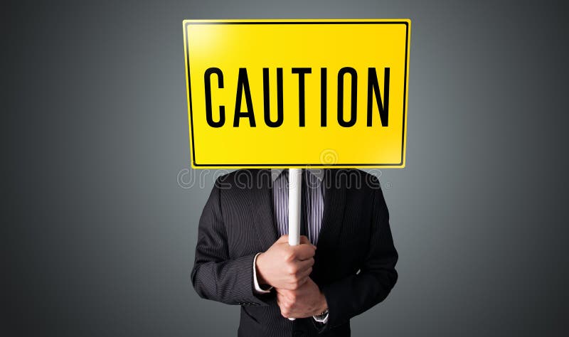 Businessman Holding a Caution Sign Stock Image - Image of handsome ...