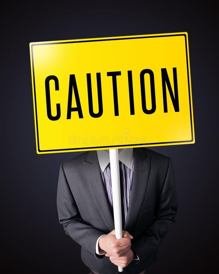 Businessman Holding a Caution Sign Stock Photo - Image of advice, mask ...