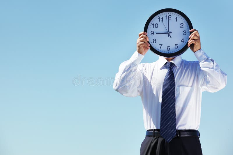 Business Man on Clock stock photo. Image of professional - 2421800