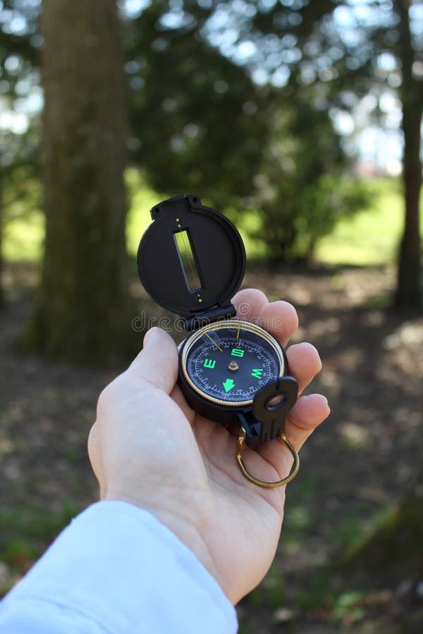 Businessman Holding a Compass Vertical Stock Image - Image of ...