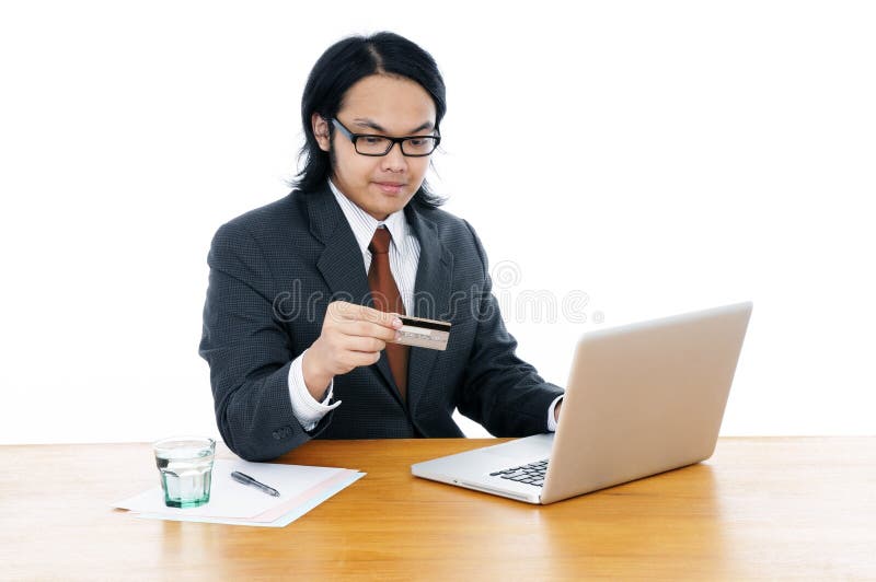 Businessman Holding Credit Card and Using Laptop Stock Photo - Image of ...