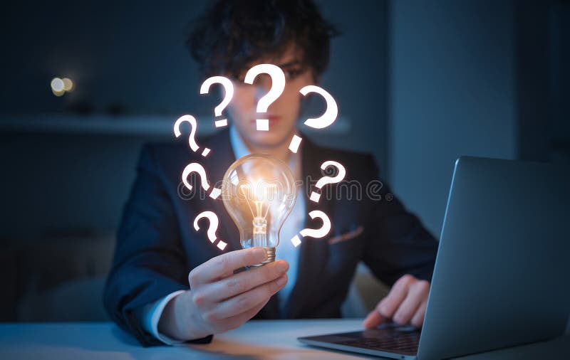 Businessman Holding Glowing Lightbulb with Floating Question Marks in ...