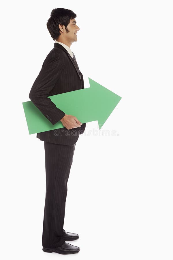 Businessman Holding a Green Arrow, Facing Left Stock Image - Image of ...