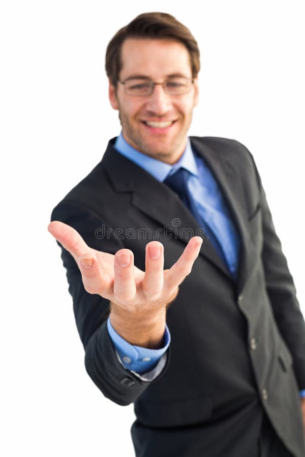 Businessman Holding Hand Out in Presentation Stock Photo - Image of ...