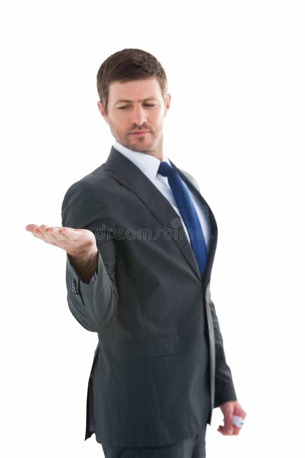 Businessman Holding Hand Out in Presentation Stock Photo - Image of ...