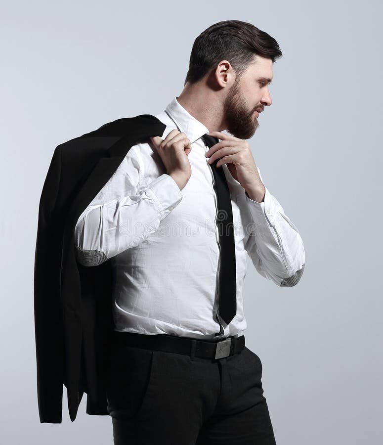Businessman Holding His Jacket Over His Shoulder and Straightens His ... Businessman Holding His Jacket Over His Shoulder and Straightens His ...