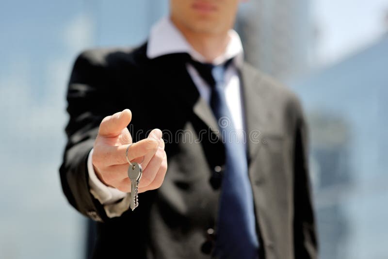 Businessman Holding a Key in His Hand Stock Image - Image of apartment ...