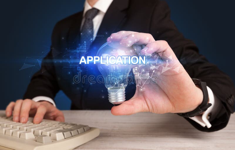 Businessman Holding a Light Bulb Stock Image - Image of industry ...