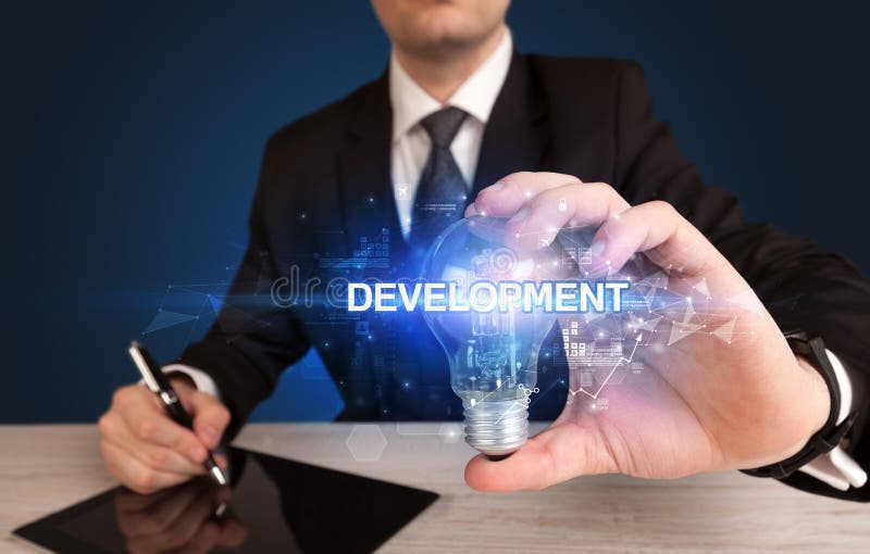 Businessman Holding a Light Bulb Stock Image - Image of imagination ...