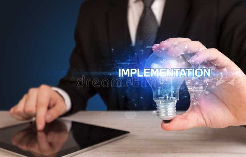 Businessman Holding a Light Bulb Stock Photo - Image of generation ...