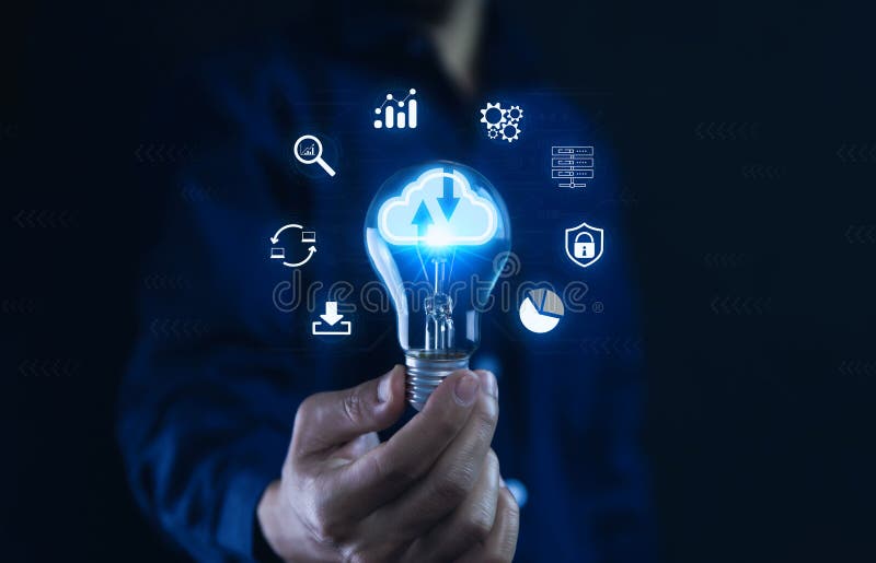 Businessman Holding a Light Bulb Showing a Diagram of Cloud Computing ...