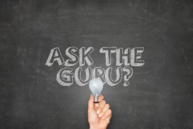 Businessman Holding Light Bulb Under Ask the Guru on Blackboard Stock ...