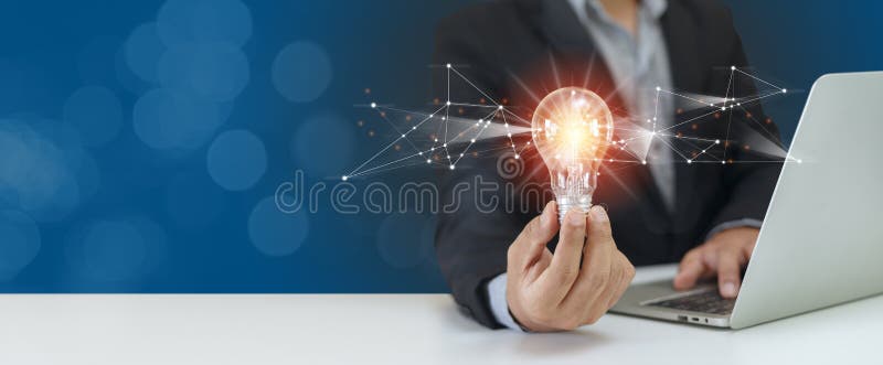 Businessman Holding Light Bulbs Using Laptop. Think Creative Innovation ...