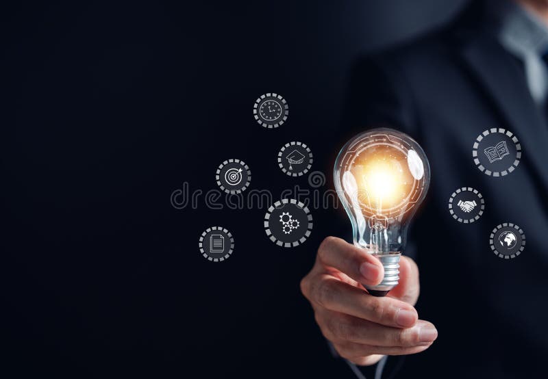 Businessman Holding Lightbulb with Learning Educate and Graduation ...