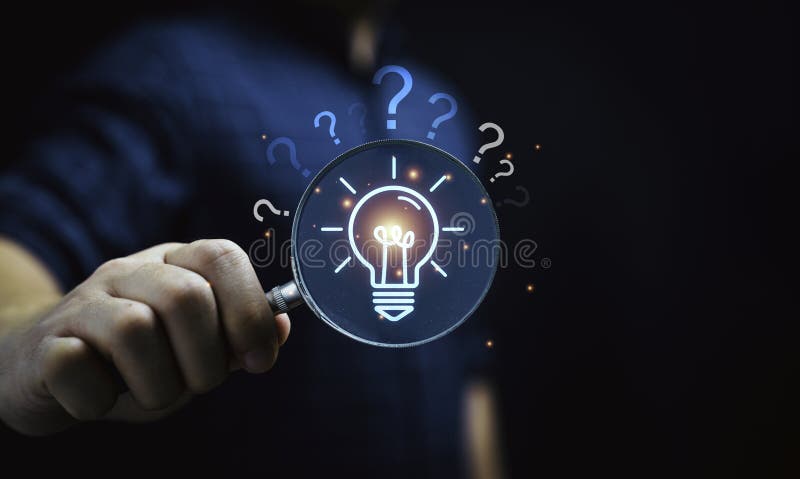 Businessman Holding Magnifier Glass with Virtual Glowing Lightbulb with ...