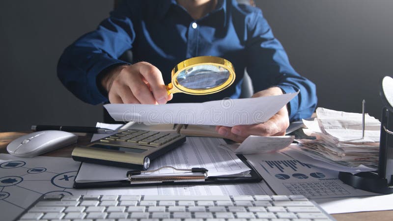 Businessman Holding Magnifying Glass with Documents Stock Photo - Image ...