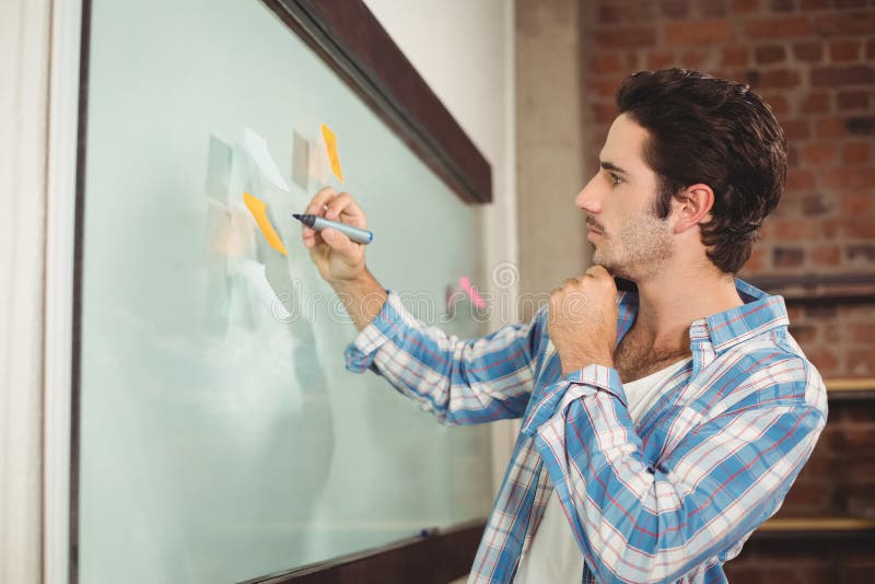 Businessman Holding Marker while Standing by Glass Board Stock Photo ...