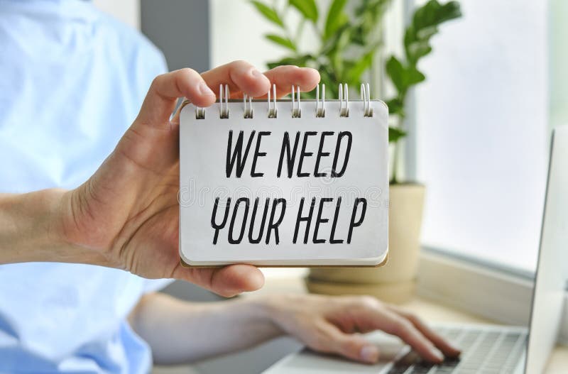 Businessman Holding a Notebook with Text we Need Your Help Stock Photo ...
