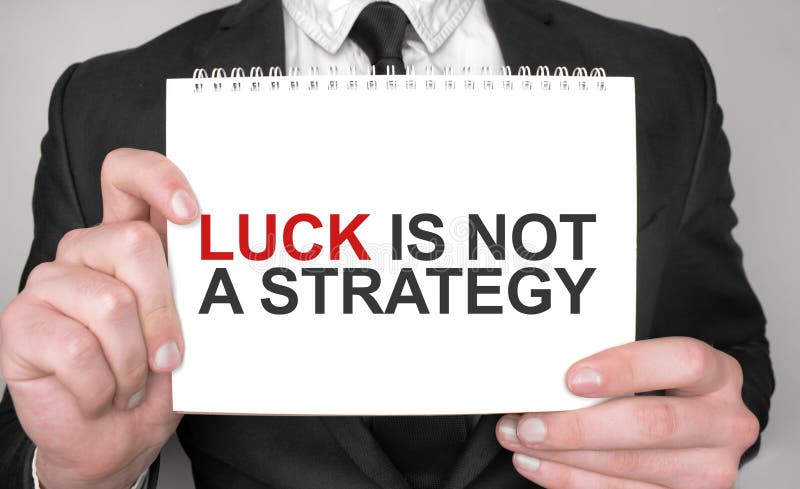 Businessman Holding a Notepad with Text Luck is Not a Strategy Stock ...