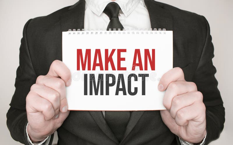 Businessman Holding a Notepad with Text MAKE an IMPACT Stock Photo ...