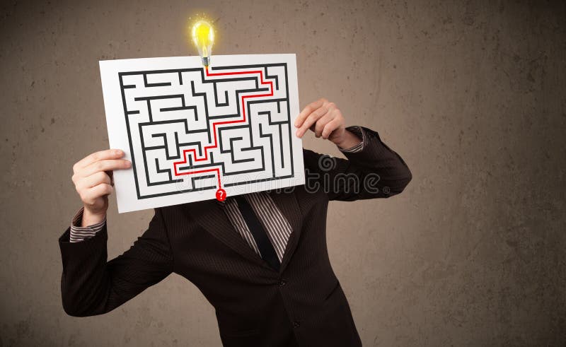 Businessman Holding a Paper with a Labyrinth on it in Front of H Stock ...