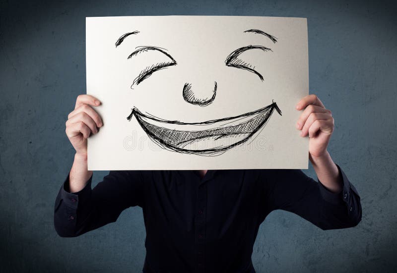 Businessman Holding a Paper with Smiley Face in Front of His Head Stock ...