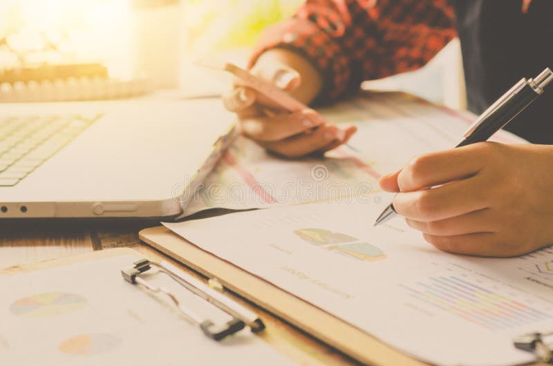Businessman Holding Paperwork on the Table and Analyzing Stock Image ...