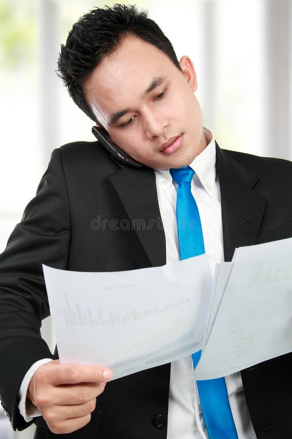 Businessman Holding a Report Stock Photo - Image of business, person ...